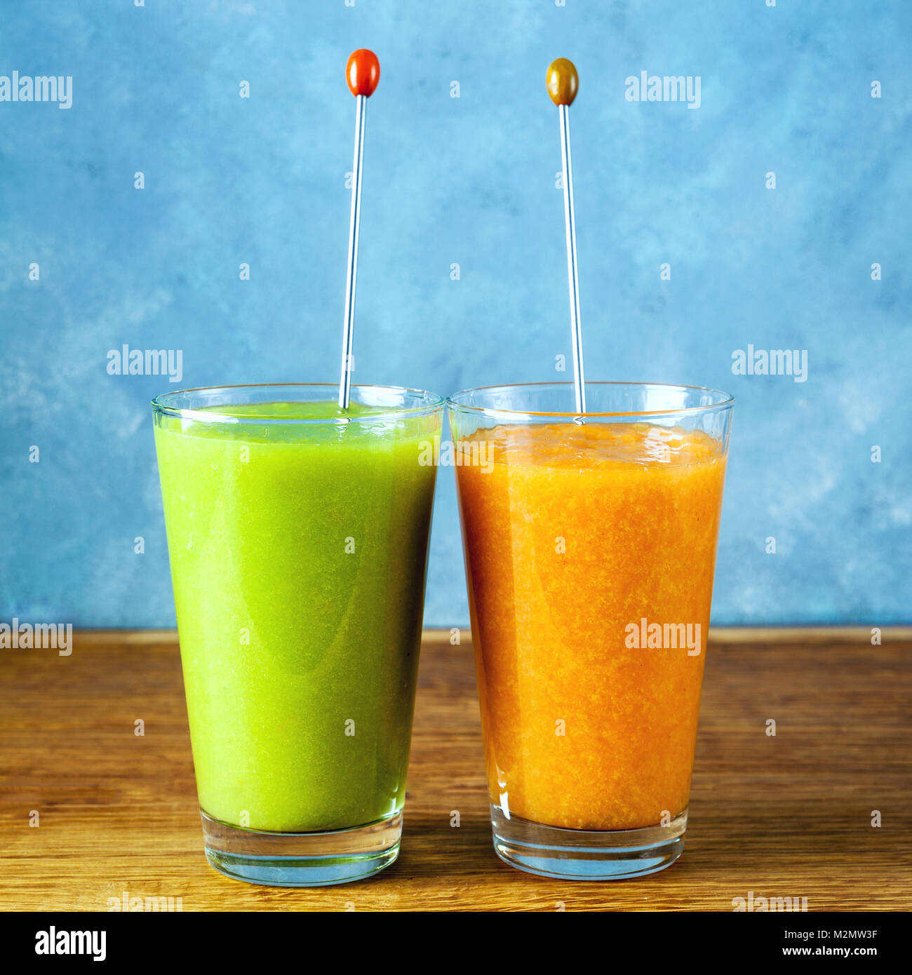 Freshly blended fruit smoothies of various colors and tastes in glass ...