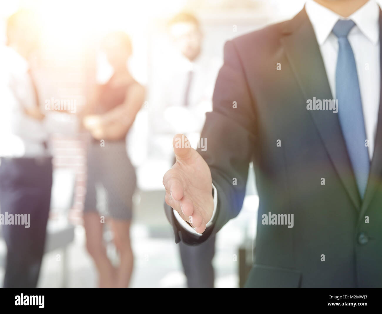 closeup. businessman holding out hand for a handshake.the concept of ...