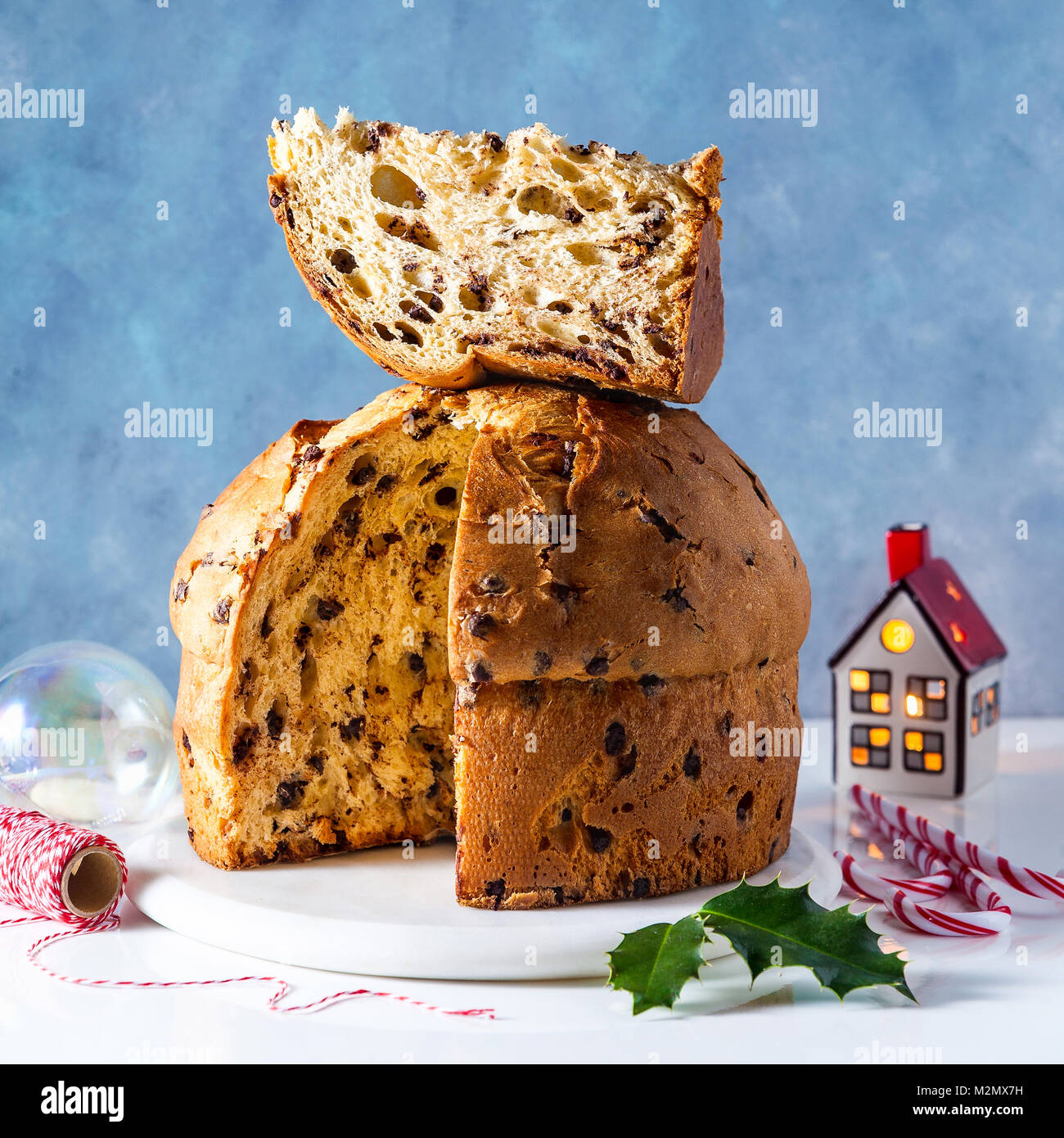 Italian festive bread panetton with chocolate on the table decorated ...