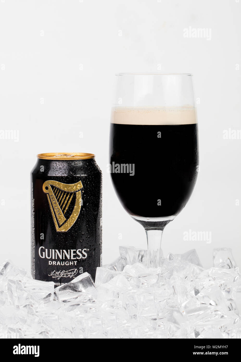 Trieste, Italy July 08 2016: Guinness stout aluminum can and beer glass ...