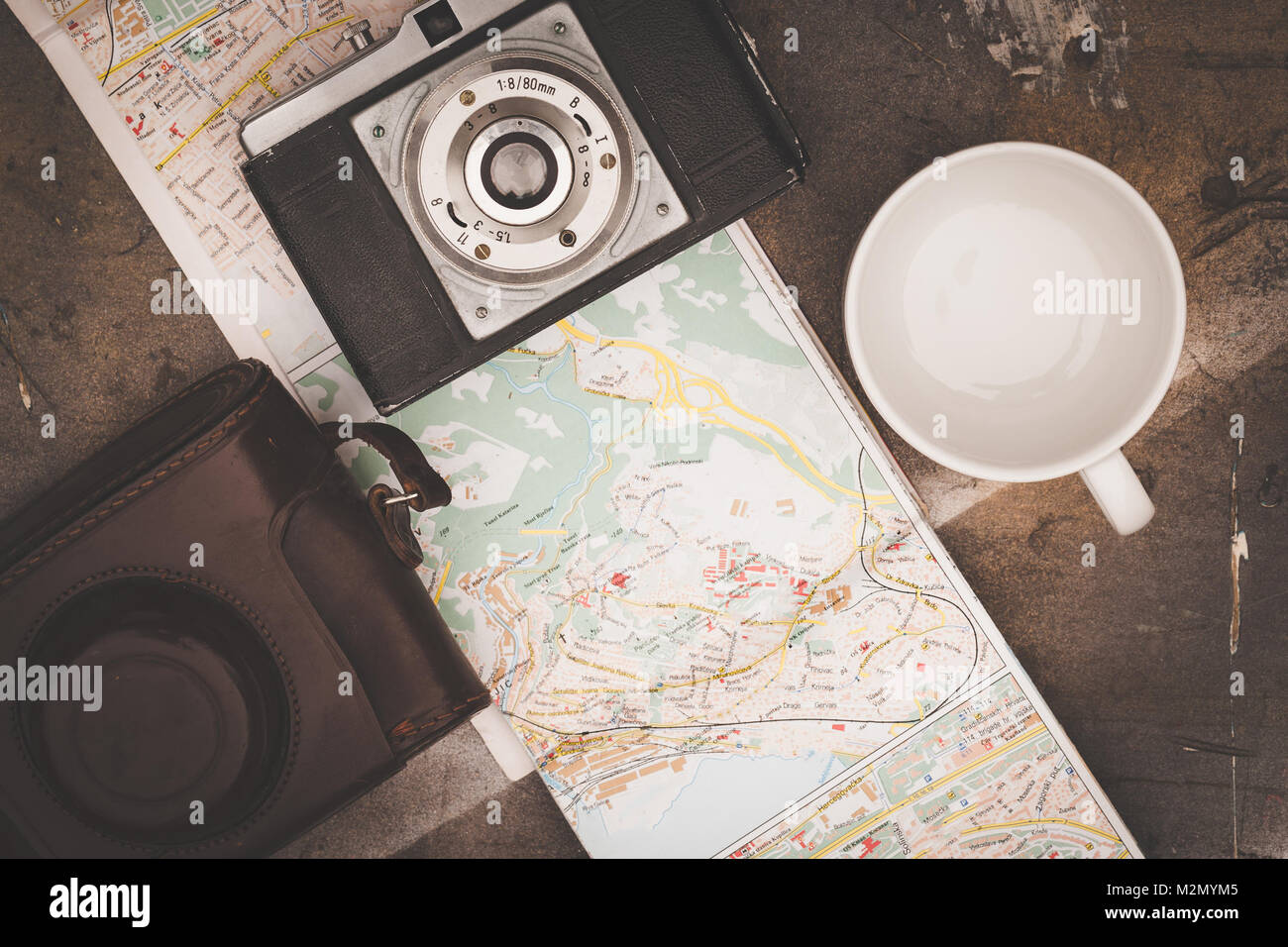 Vintage camera and map on wooden boards abstract background. Copy space ...