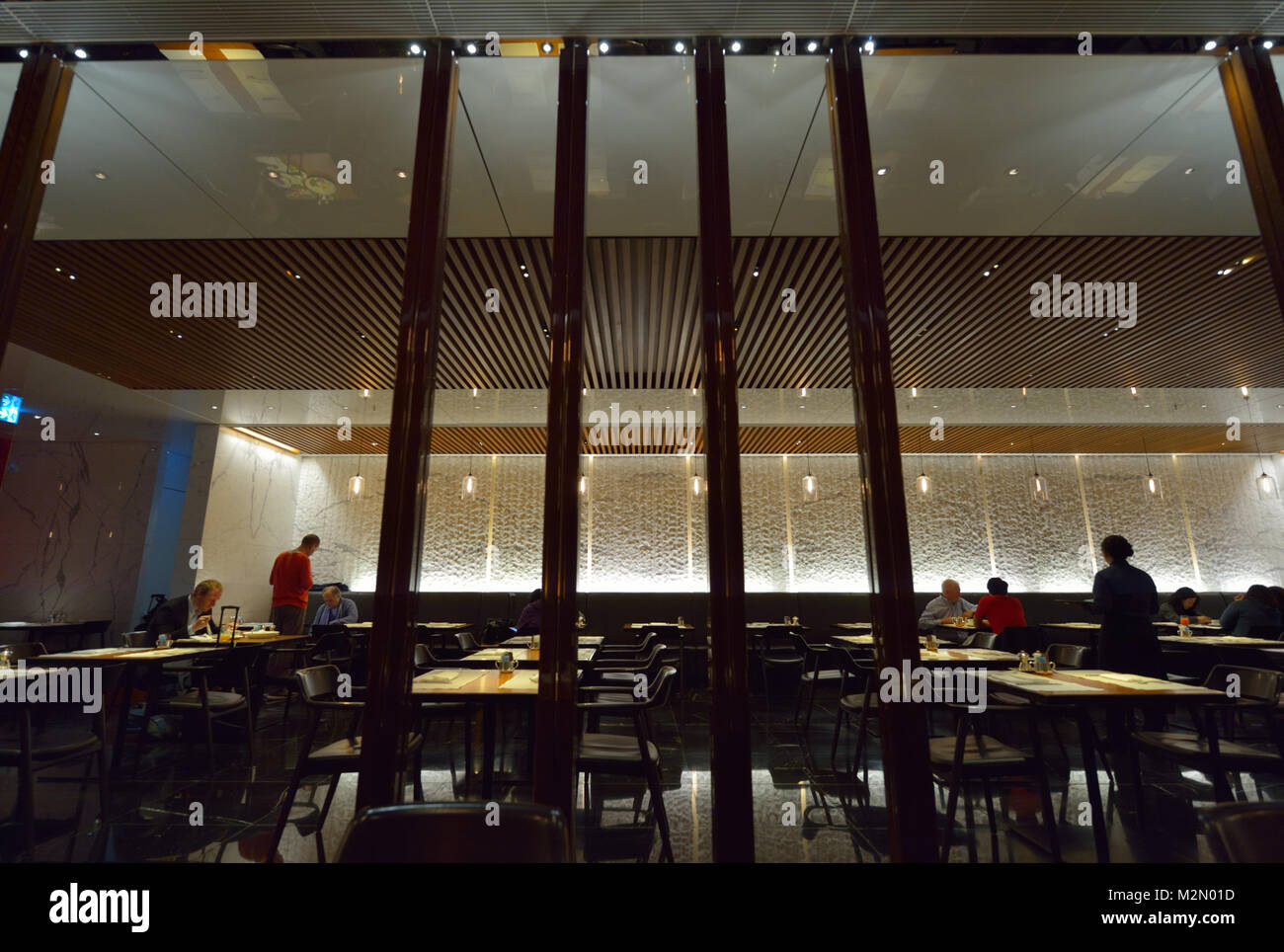 The stylish dining section at The Wing - First Class Lounge of Cathay ...