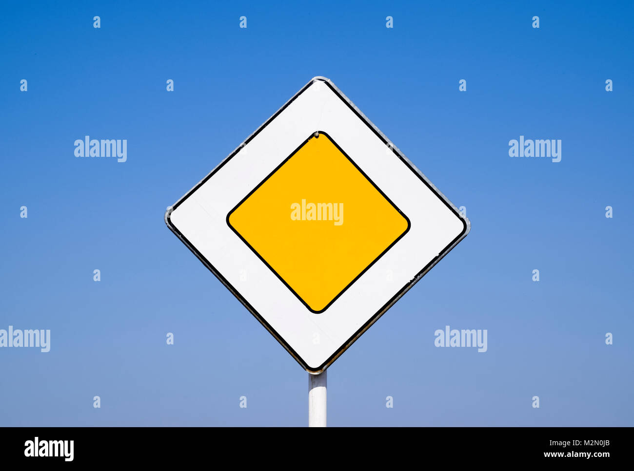 Road signs, the main road. Sign on a blue background Stock Photo - Alamy