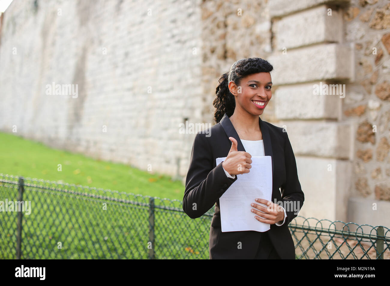 International student reading exam results Stock Photo - Alamy