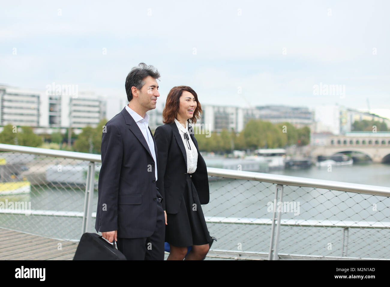 economists male and female in strict suits walking Stock Photo - Alamy
