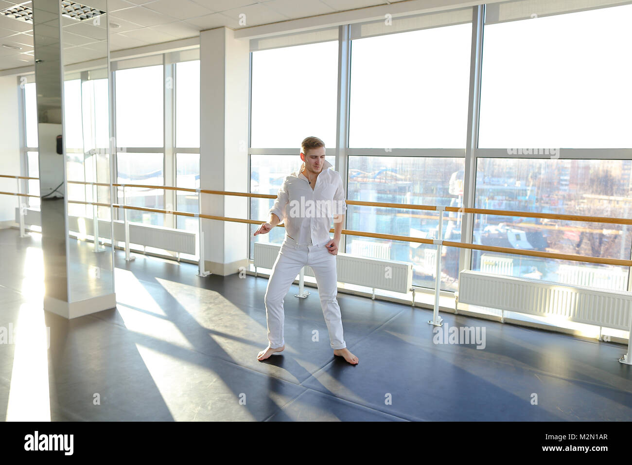 Guy making somersault backwards at studio Stock Photo - Alamy