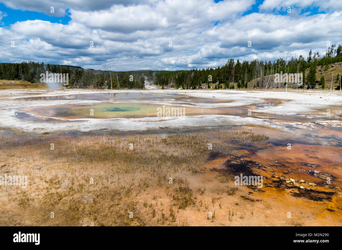 Chromatic Pool in the Upper Geyser Basin is one of the most distinctive ...