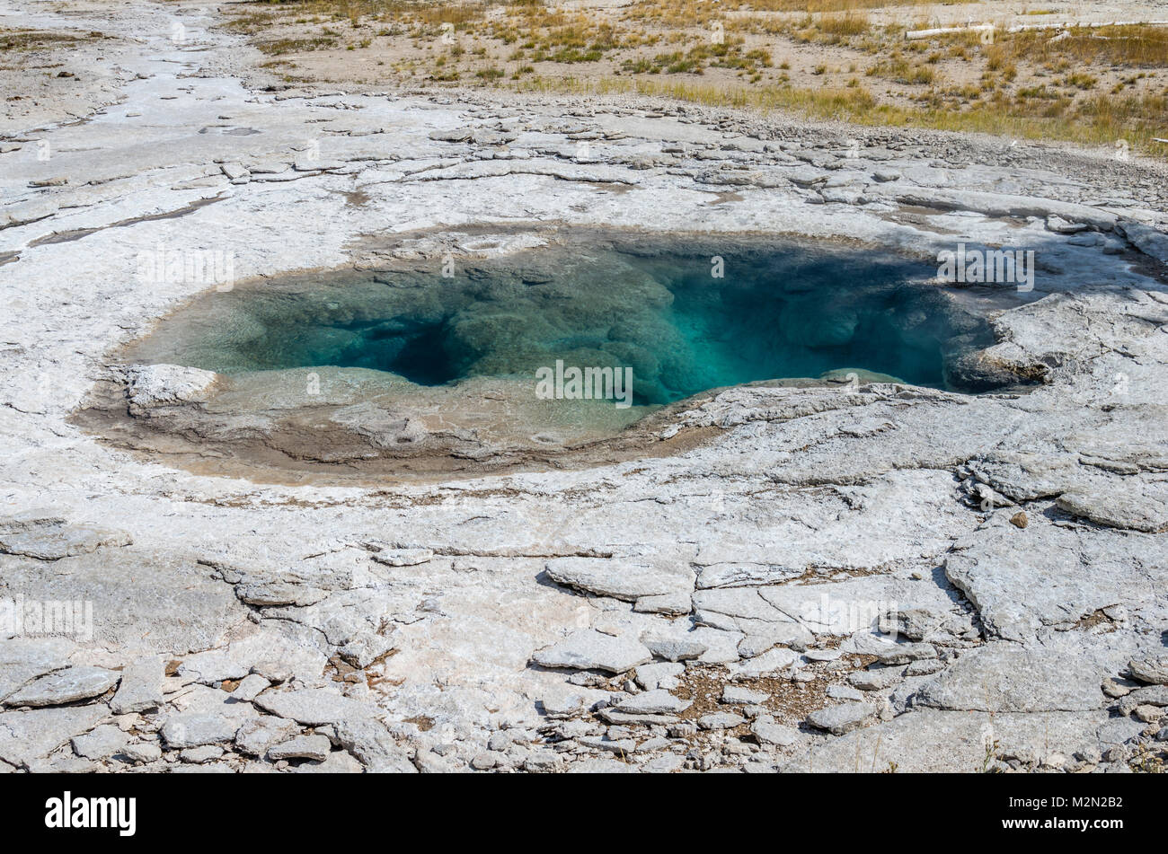 Spa Geyser in the Upper Geyser Basin is surrounded by geyserite ...