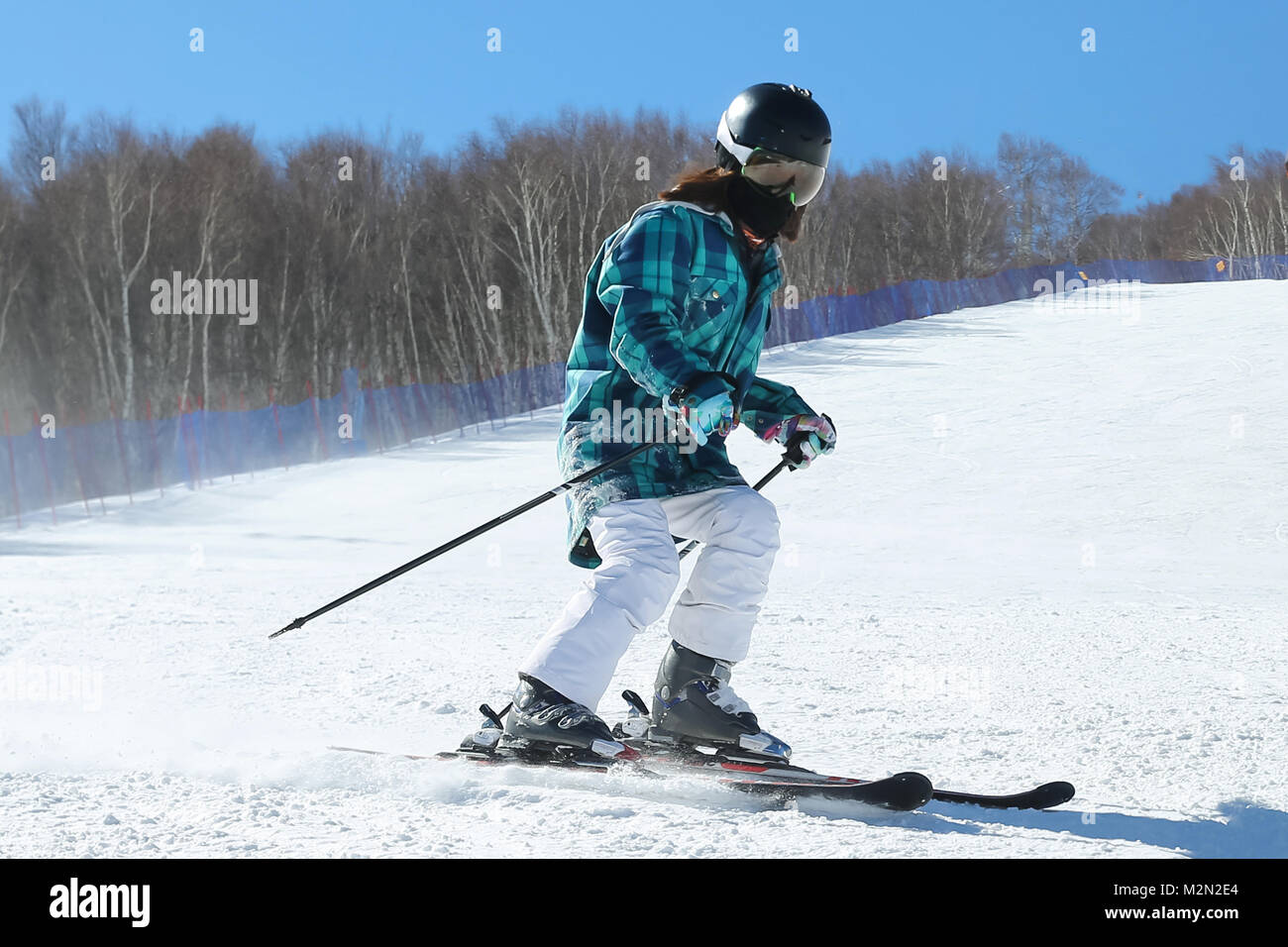 Young woman outdoor skiing Stock Photo - Alamy