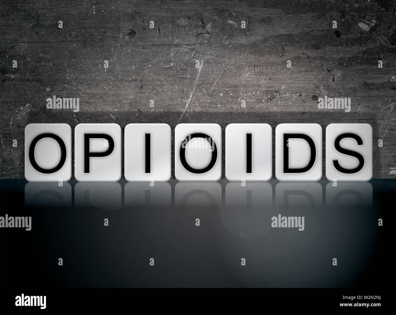 The word Opioids concept and theme written in white tiles on a dark ...