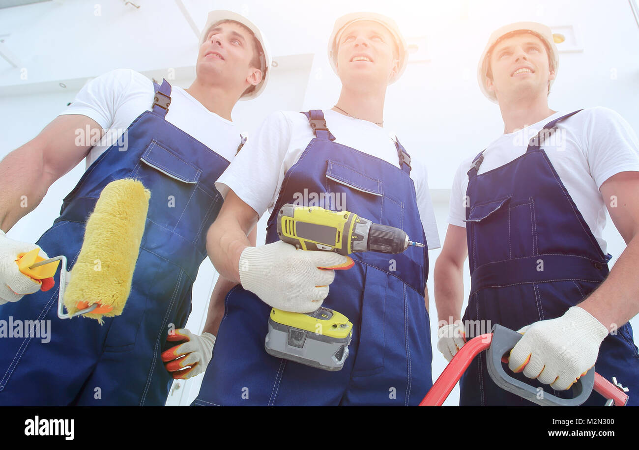 professional team of builders with tools Stock Photo - Alamy