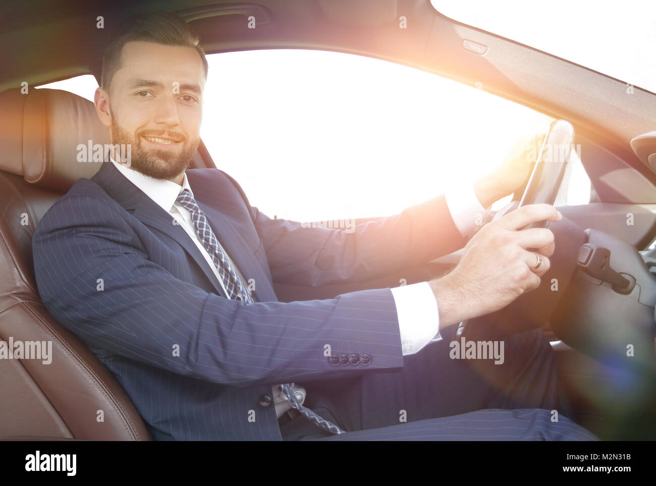 portrait of confident businessman driving a car Stock Photo - Alamy