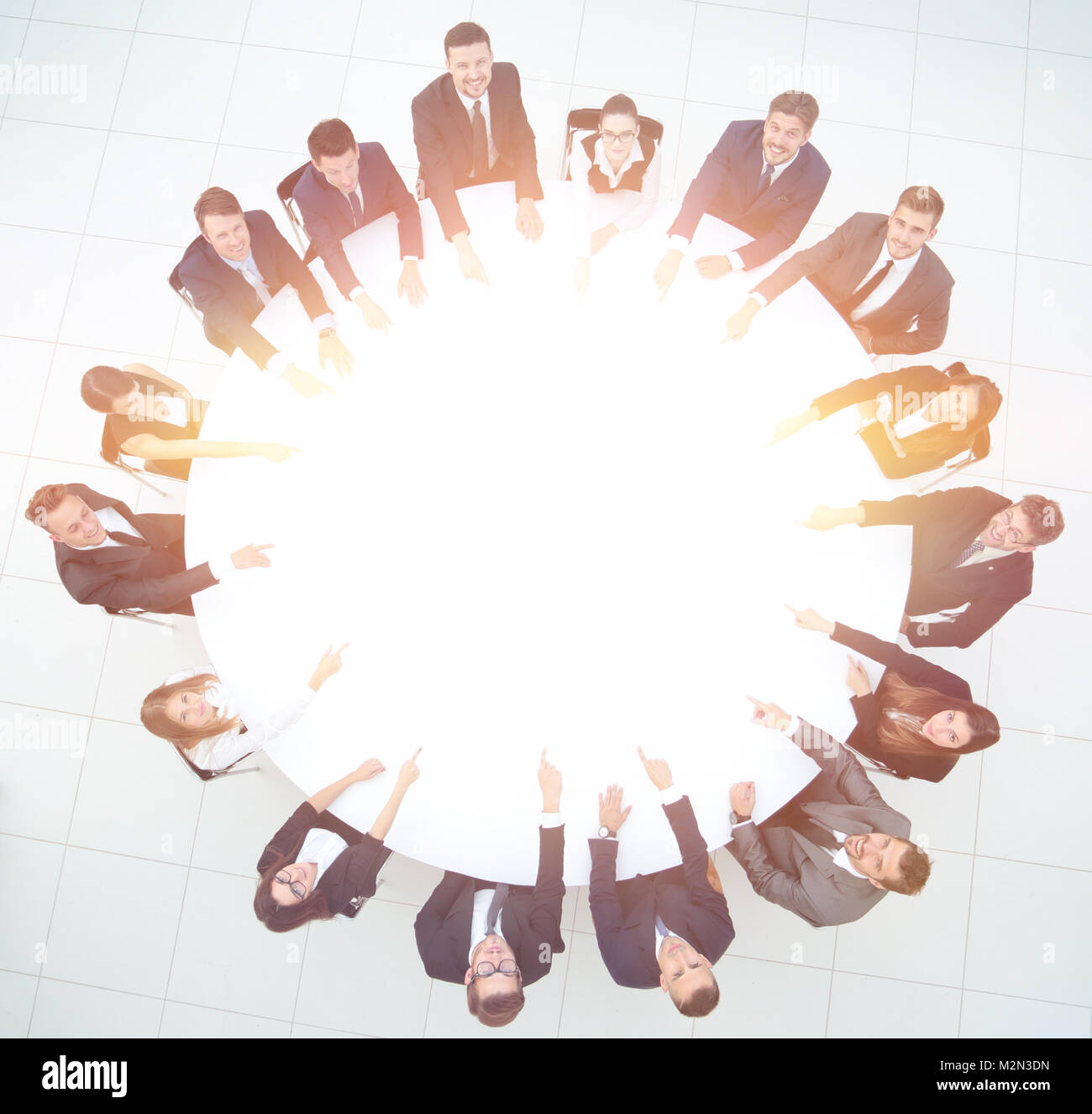 group of business people sitting at the round table. the business ...