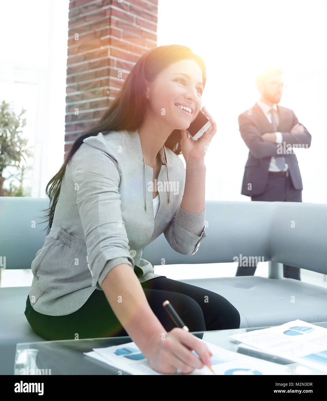 Woman assistant at the workplace in the office Stock Photo - Alamy