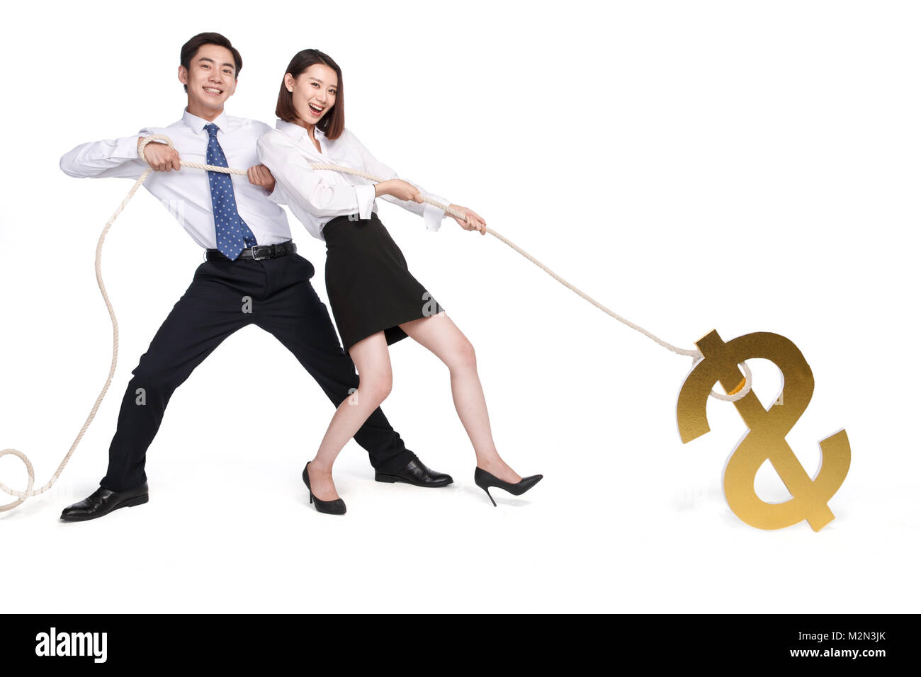 Two indian women pulling rope hi-res stock photography and images - Alamy