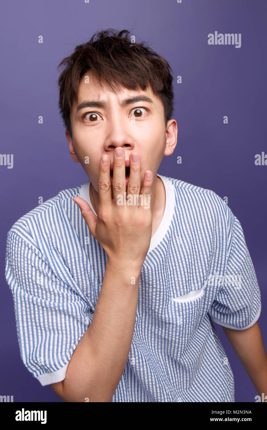 Facial expressions shock of young men Stock Photo - Alamy