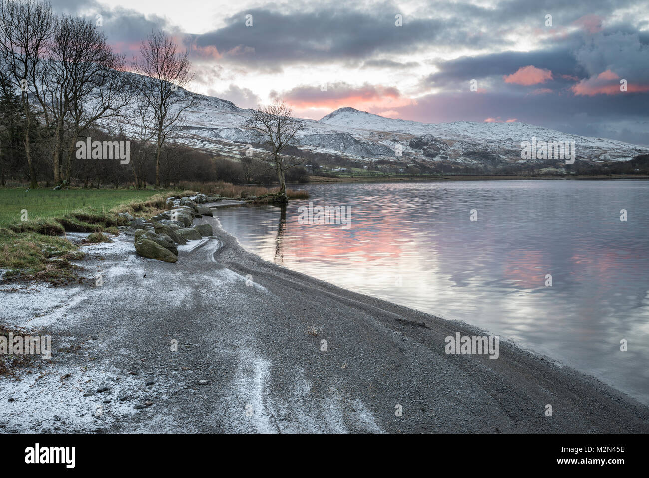 Beautiful sunrise landscape image in Winter of Llyn Cwellyn in ...