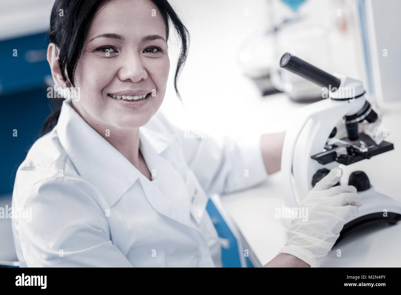 Cheerful female scientist smiling into camera Stock Photo - Alamy