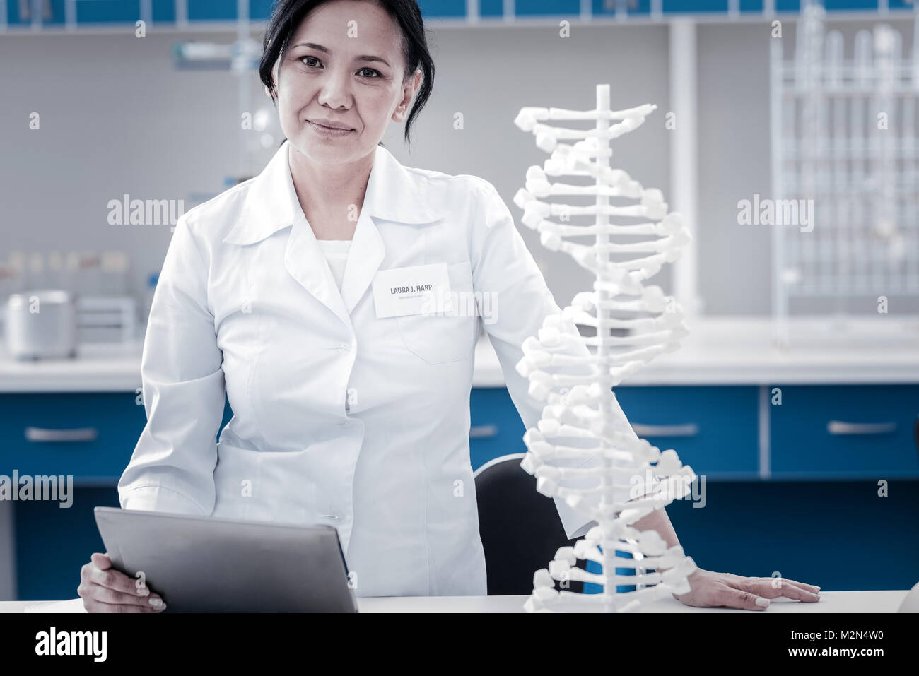 Female genetic scientist posing for camera in laboratory Stock Photo ...