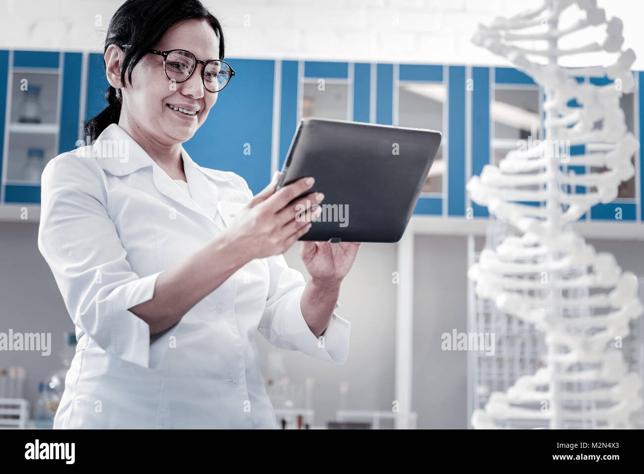 Scientist using tablet hi-res stock photography and images - Alamy