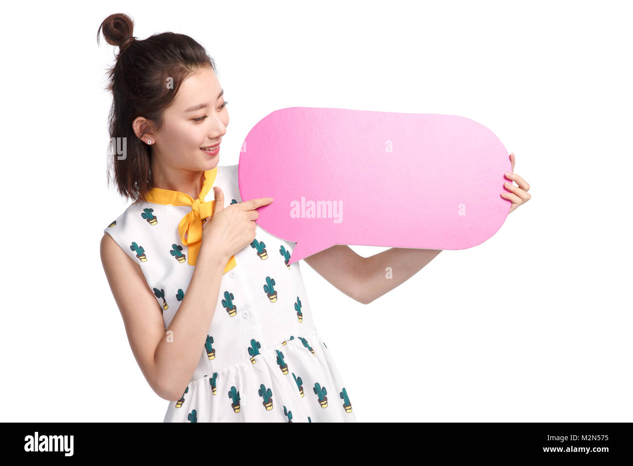 The fashionable young woman holding a dialog box Stock Photo - Alamy