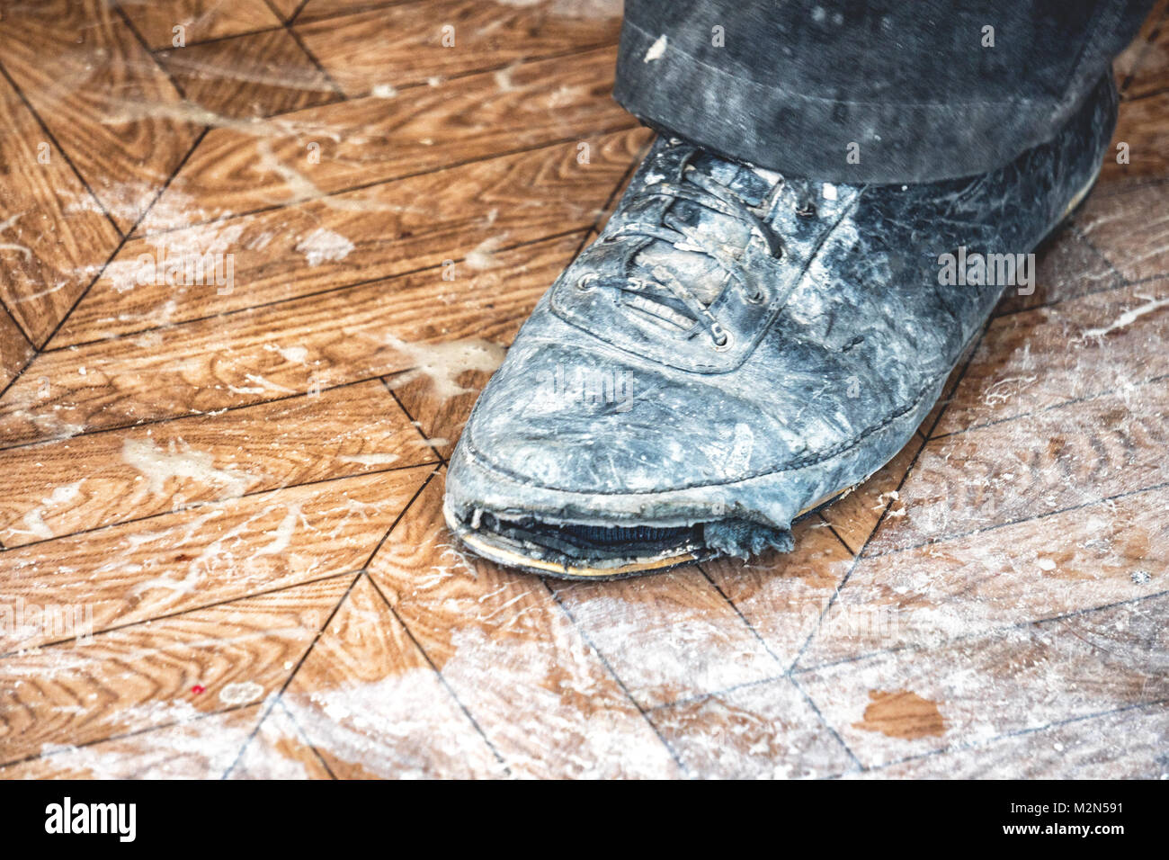 Old dirty ripped shoes clad on foot Stock Photo - Alamy