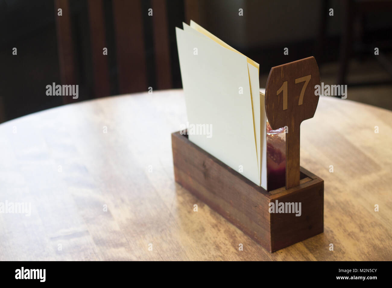 top view of restaurant table setting with ketchup wood box and white ...