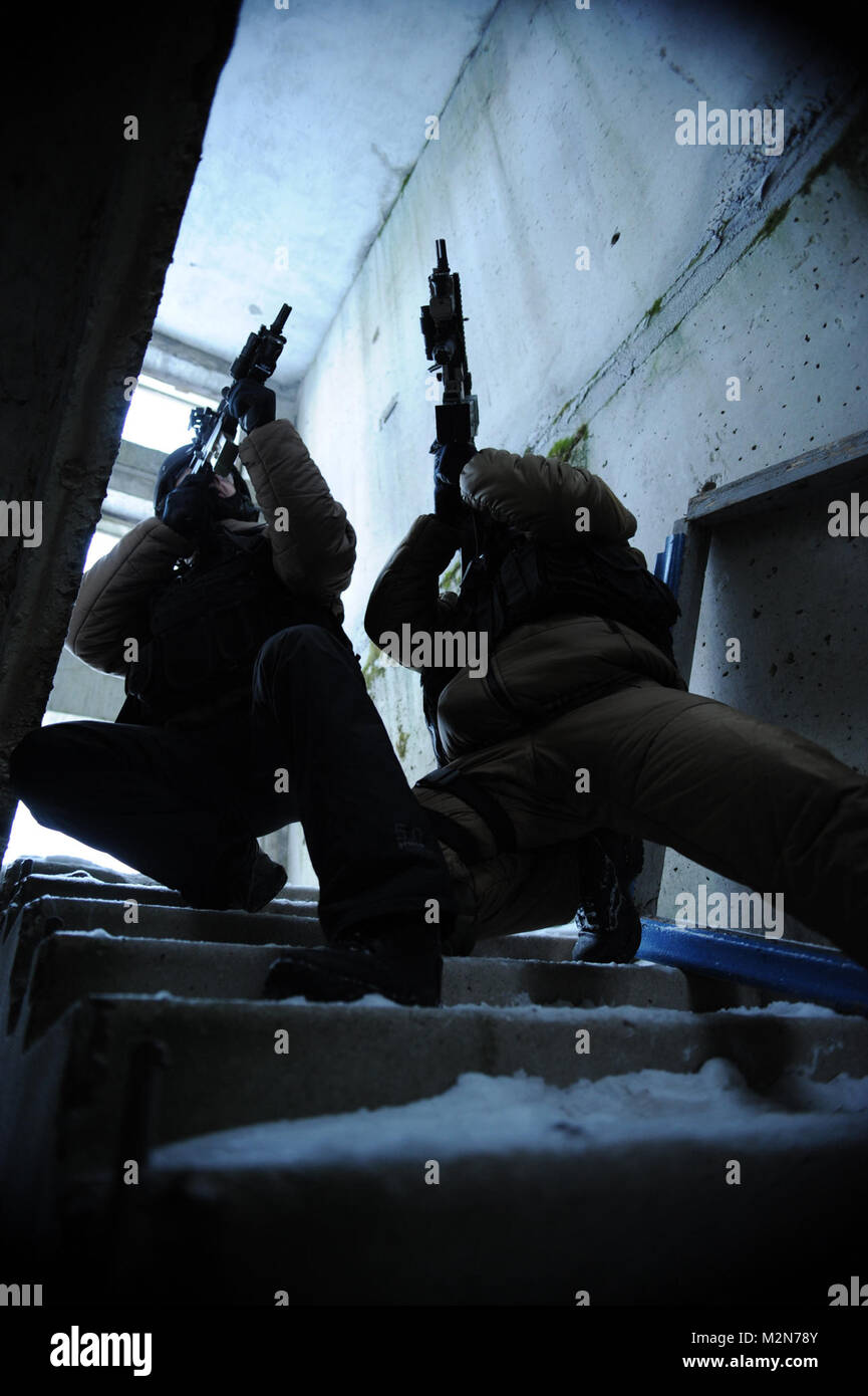 Latvian Special Operation Forces (SOF) soldiers conduct a simulation ...