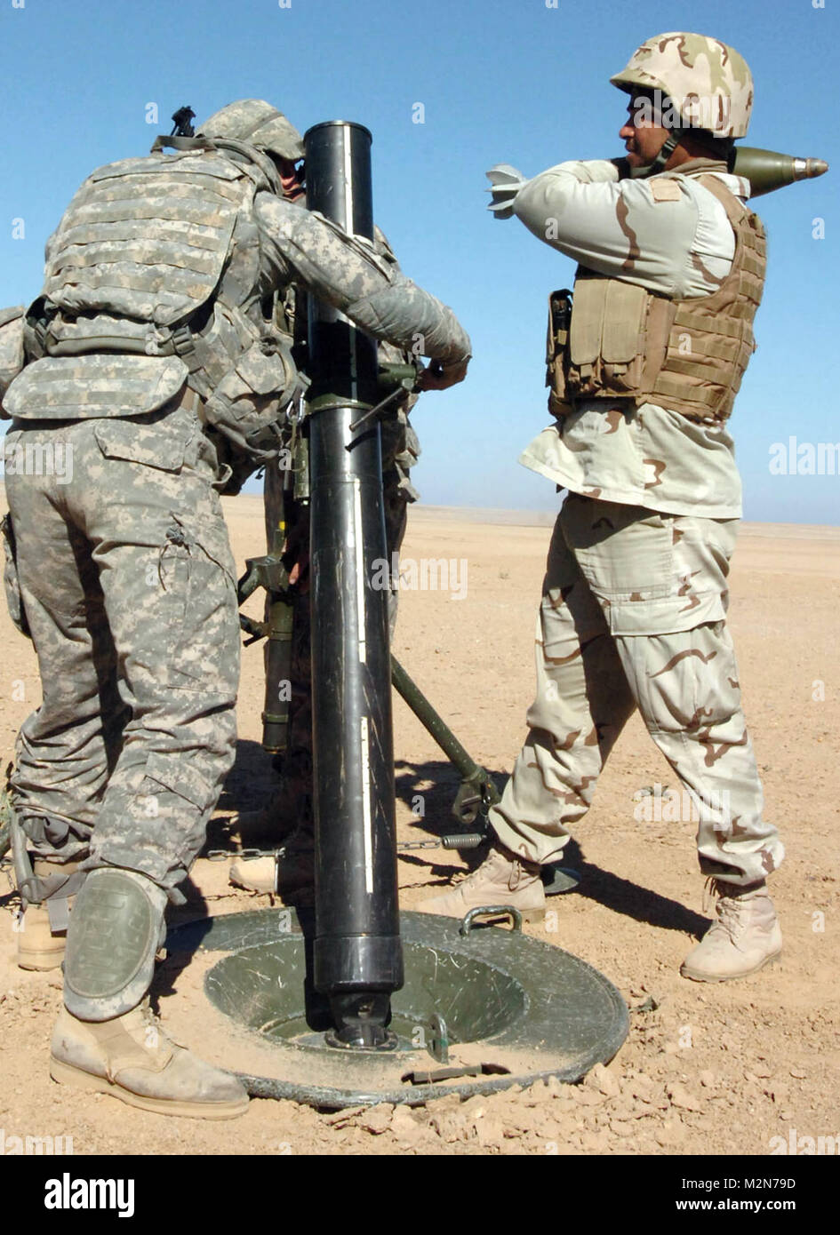 Mortarmen with 1st Brigade, 1st Iraqi Army Division, fire live mortar ...
