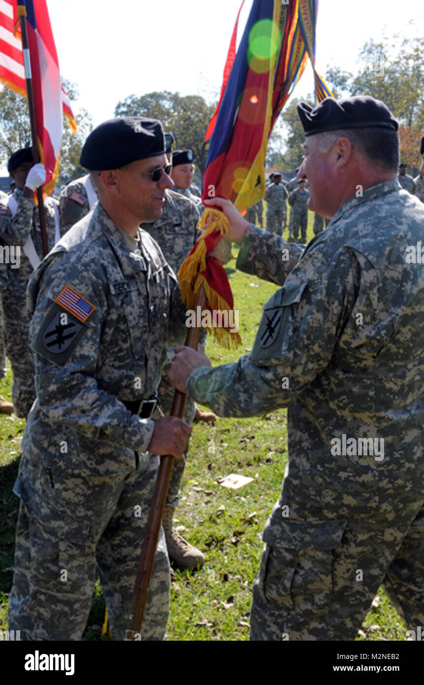 Command Sgt. Major Joseph Recker, left, receives the colors of the 48th ...