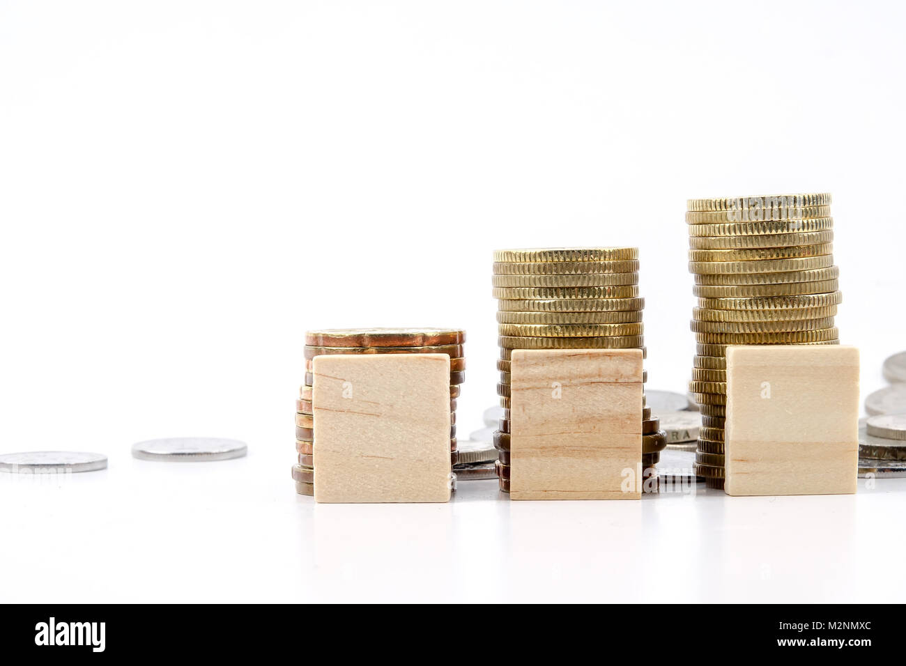 BUSINESS CONCEPT: Coins and wooden plate Stock Photo - Alamy