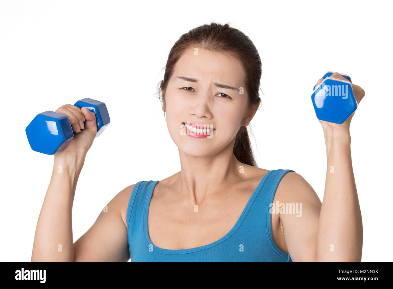 Beautiful Asian woman working out using dumbbell weights isolated on a ...