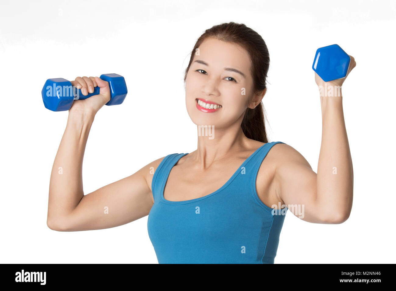 Beautiful Asian woman working out using dumbbell weights isolated on a ...