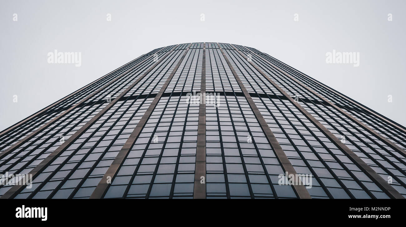 Low angle view skyscraper reflective glassy walls and windows ...