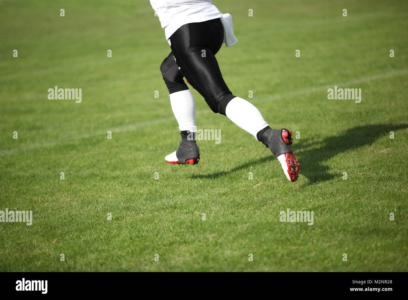 Running with a football hi-res stock photography and images - Alamy