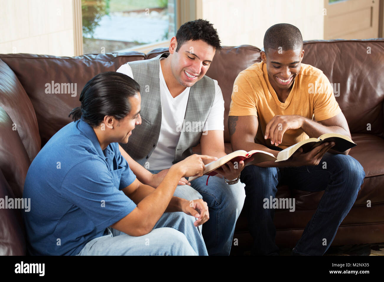 Small community group of men Stock Photo - Alamy