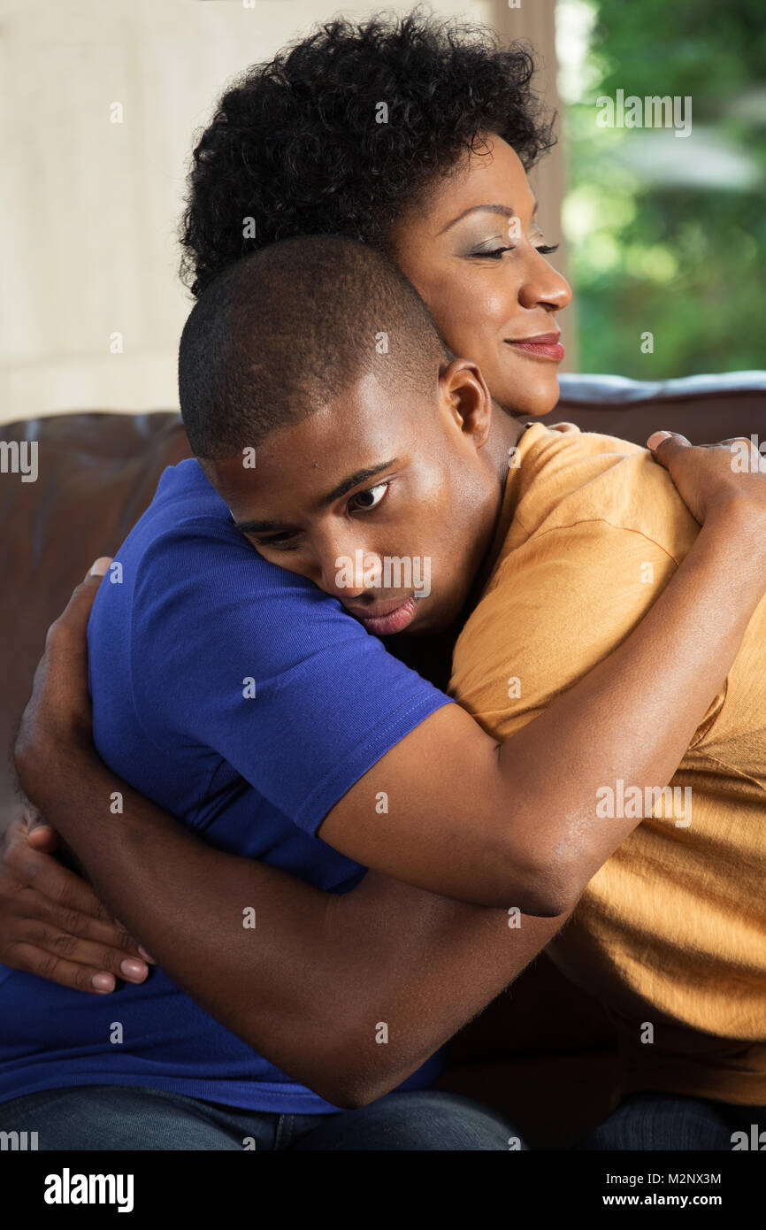 Mother hugging her adult son Stock Photo - Alamy