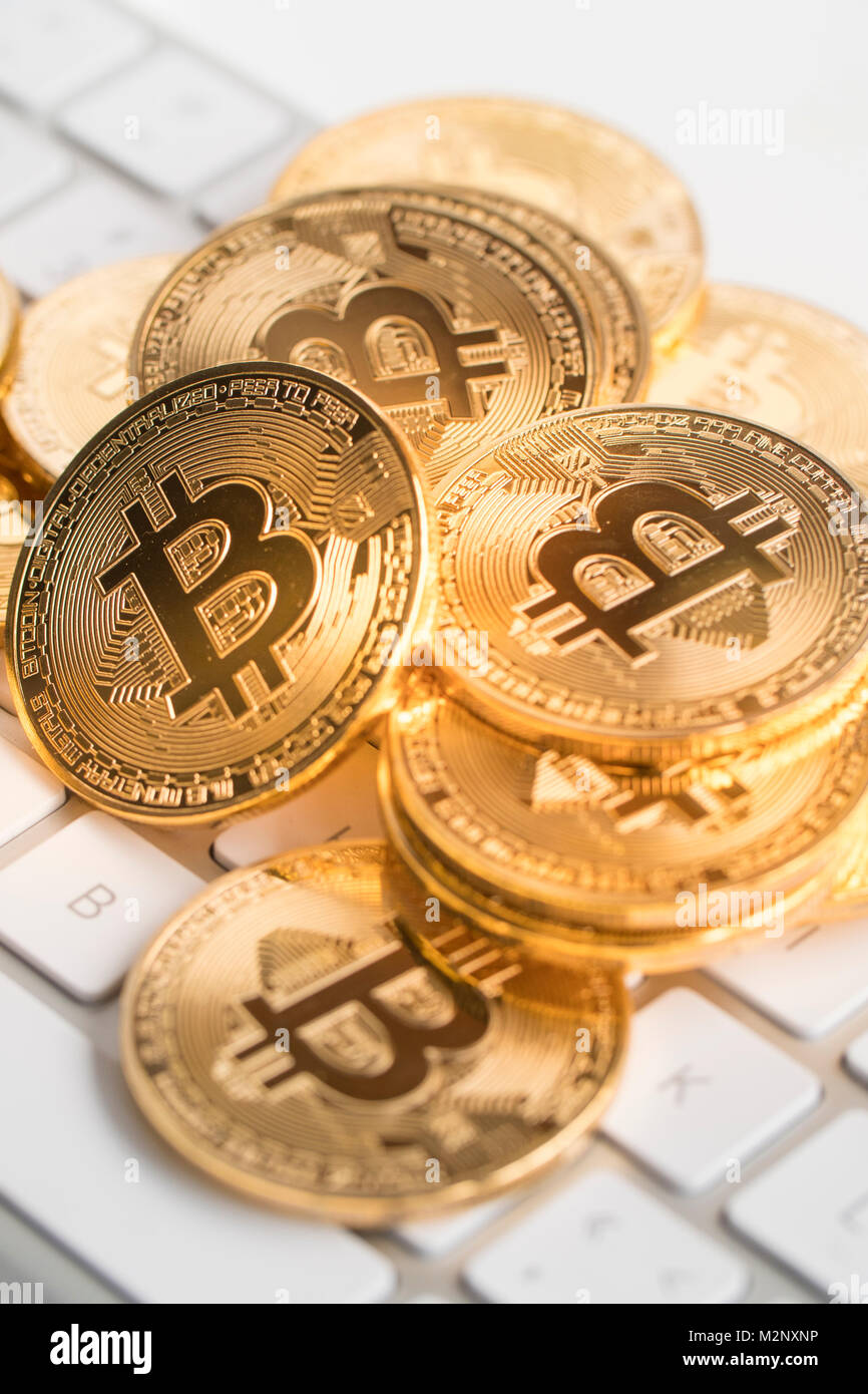 Bitcoin with little figure on keyboard Stock Photo - Alamy