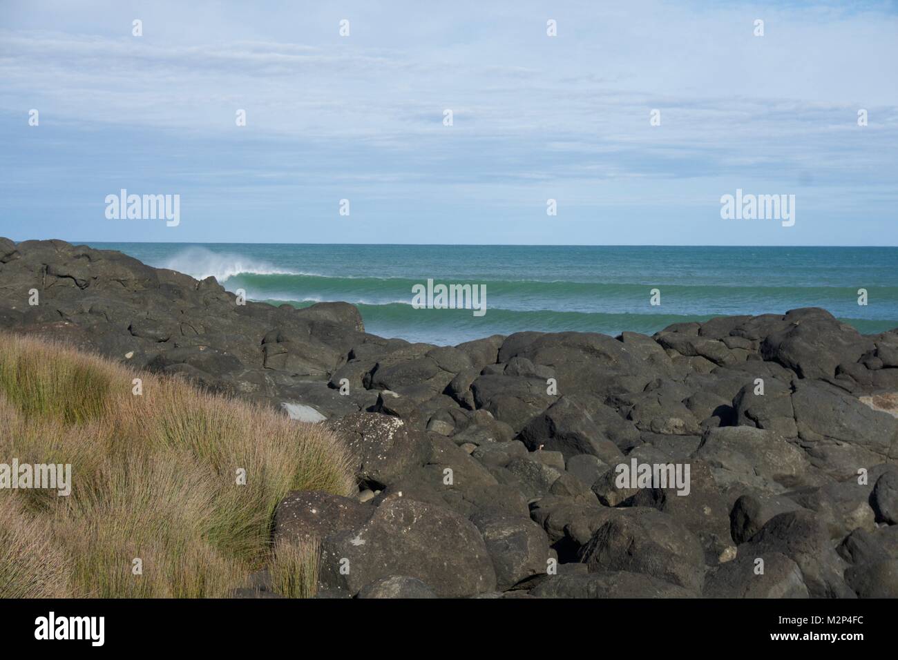 Waves rocks & wind Stock Photo - Alamy