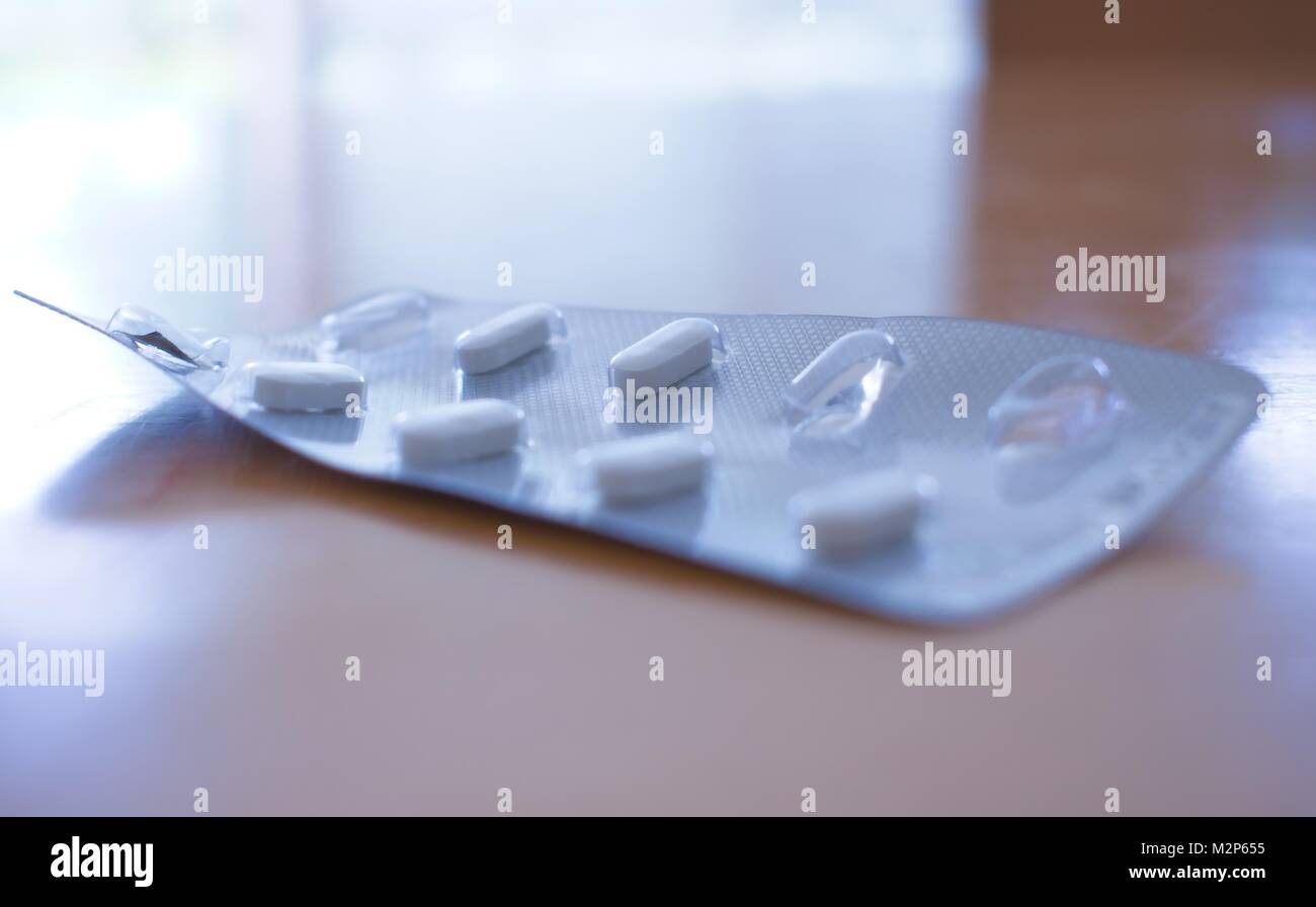Pack of pills/medication on the table Stock Photo - Alamy