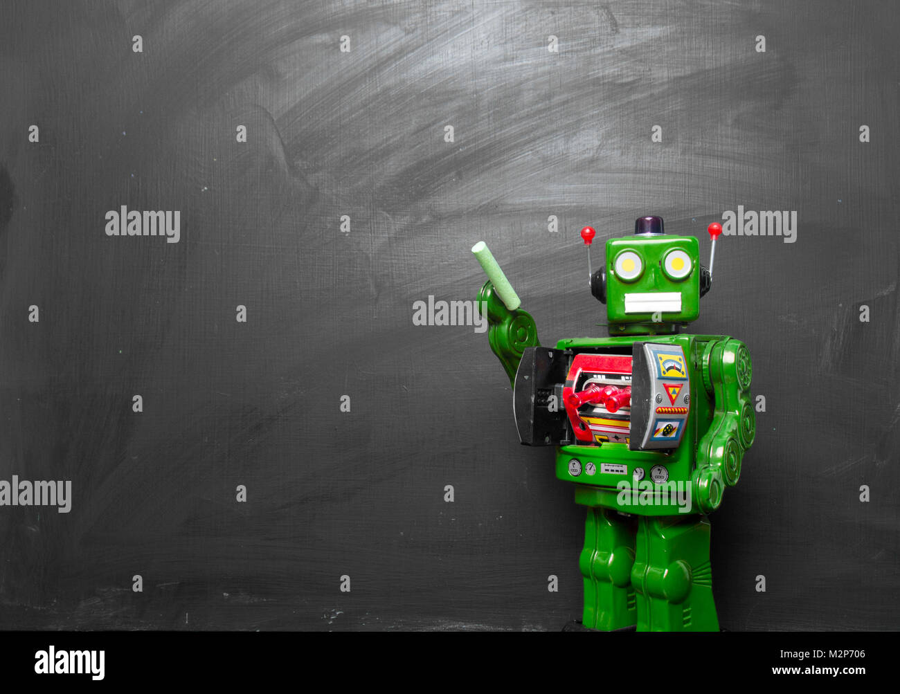 Big green robot toy teaches his class , blackboard and copy space Stock ...