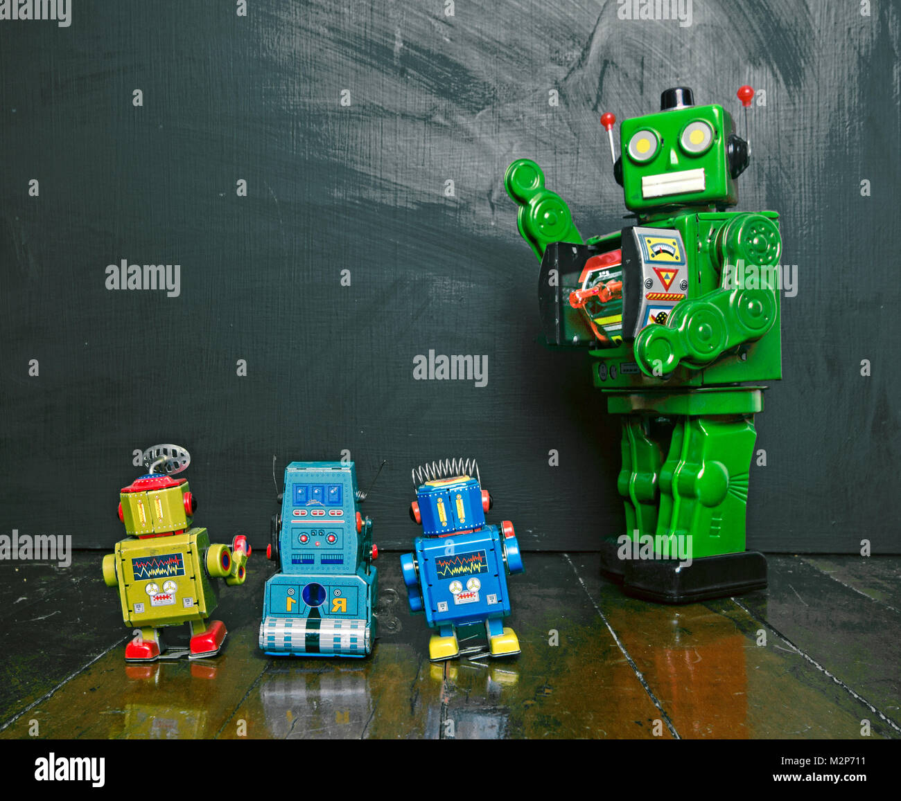 Big green robot toy teaches his class , blackboard and copy space Stock ...