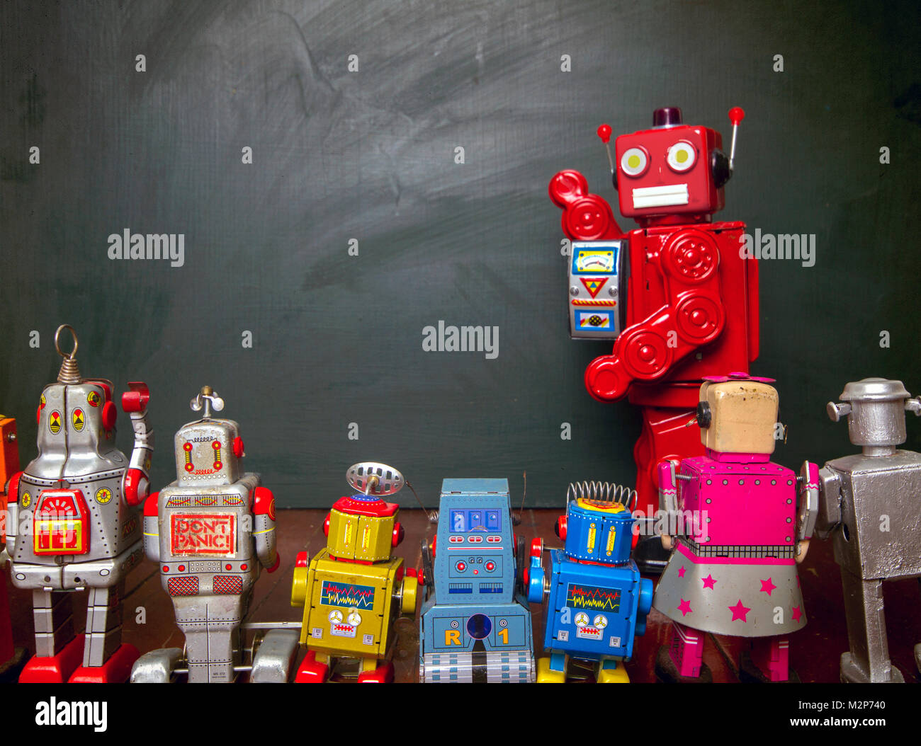 Big red robot toy teaches his class , blackboard and copy space Stock ...