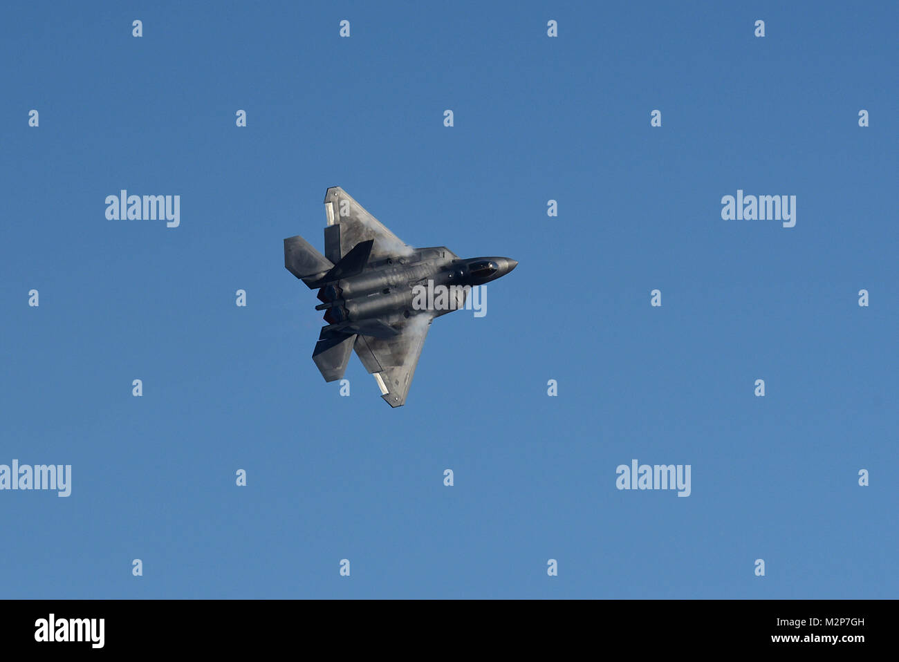 An F-22 Raptor from the Air Combat Command F-22 Demonstration Team at ...