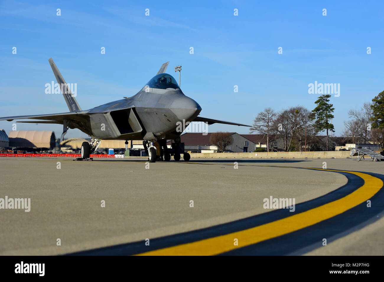 An F-22 Raptor from the Air Combat Command F-22 Demonstration Team at ...