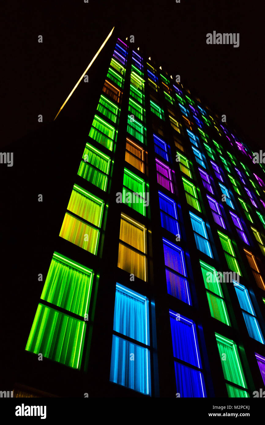 Colored windows texture. Windows illuminated by neon lights background ...
