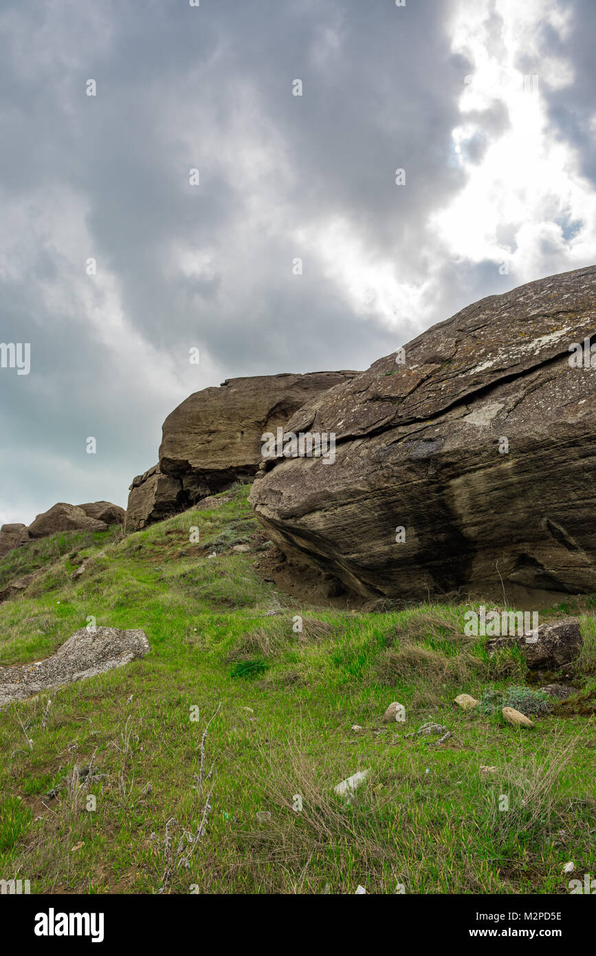 Rocks fragments in the highlands, green meadow Stock Photo - Alamy