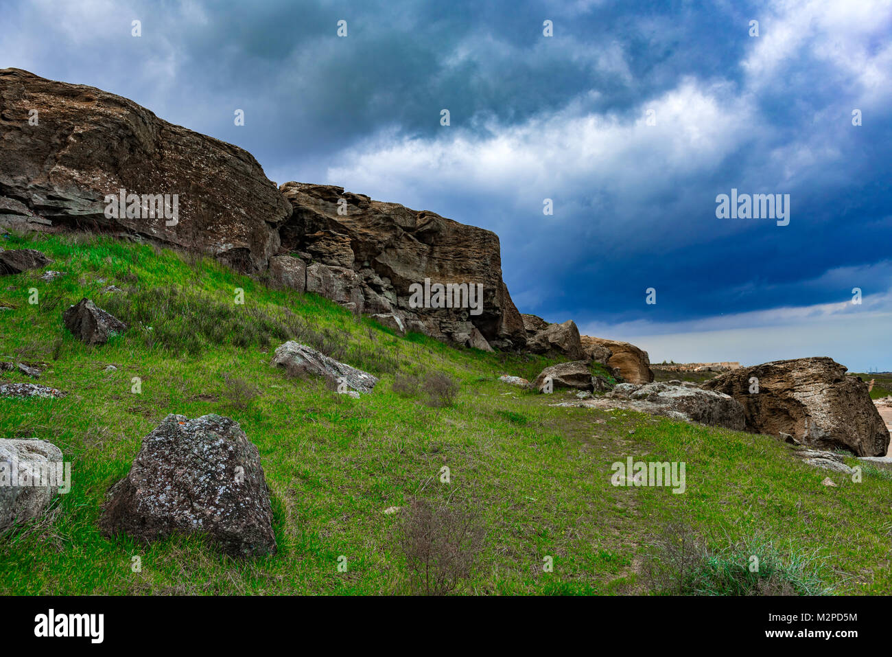 Rocks fragments in the highlands, green meadow Stock Photo - Alamy