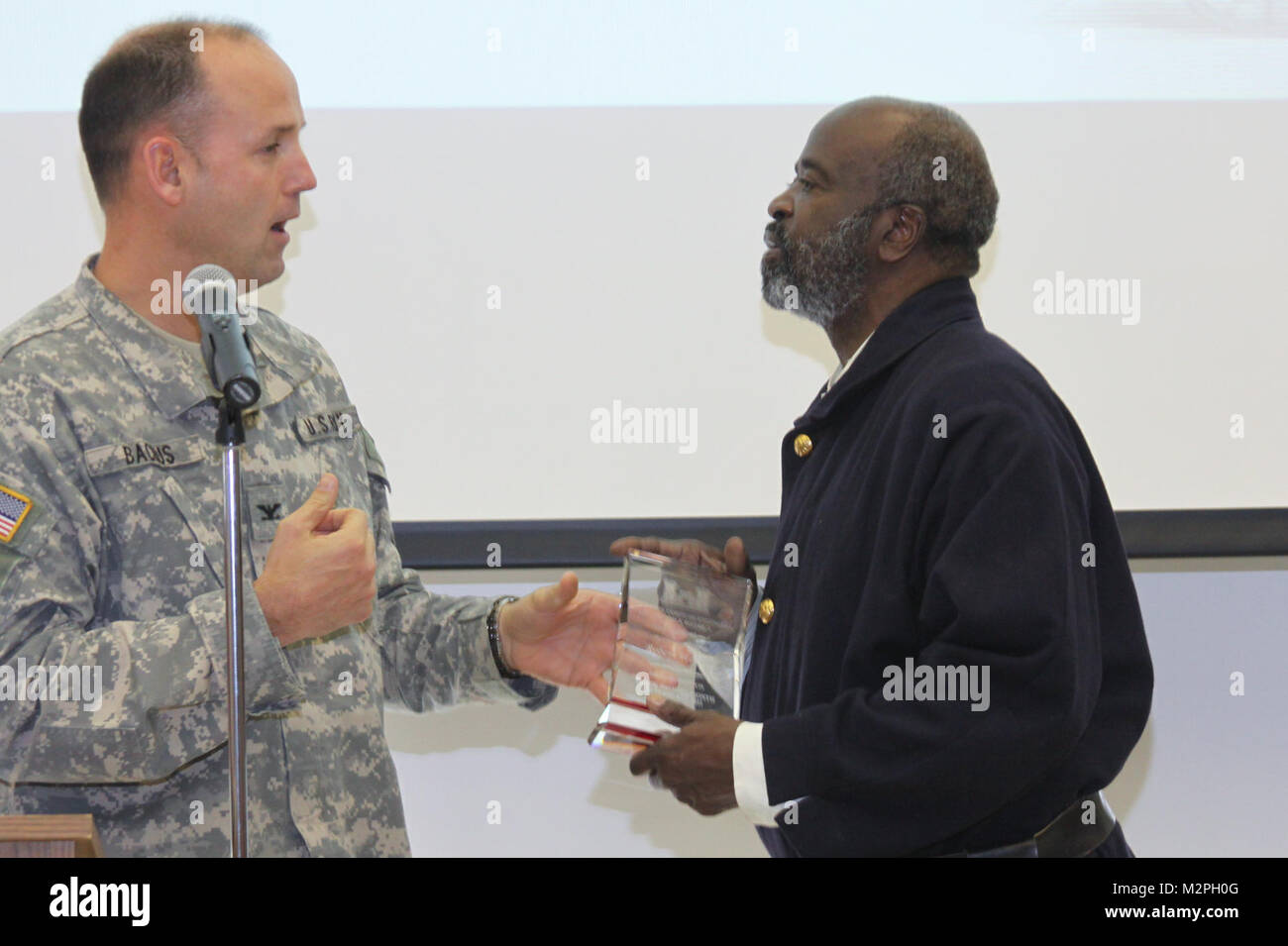 Col. Andy Backus, presents a Norfolk District plaque to Robert C ...