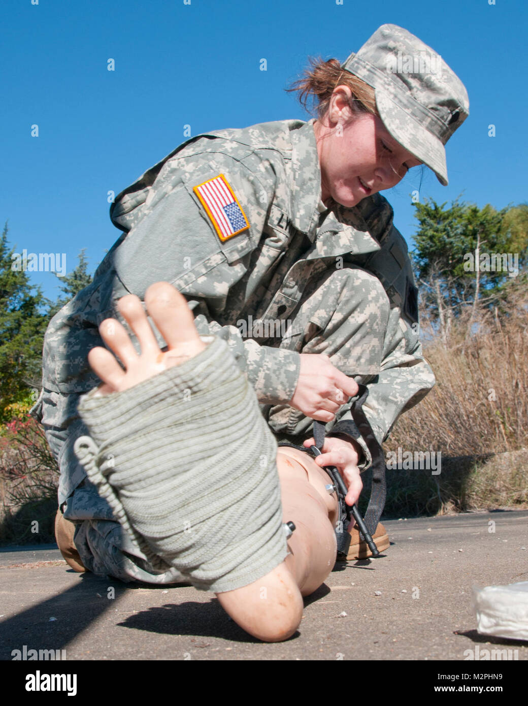 A member of the Oklahoma Army National Guard simulates first aid ...